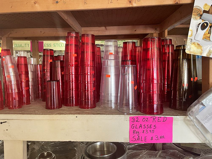 Red glassware catches the light like rubies, transforming ordinary drinking vessels into something worthy of a toast.