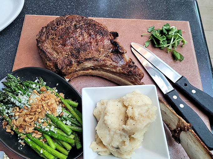 This tomahawk steak commands respect, arriving with sides that complement rather than compete for attention.