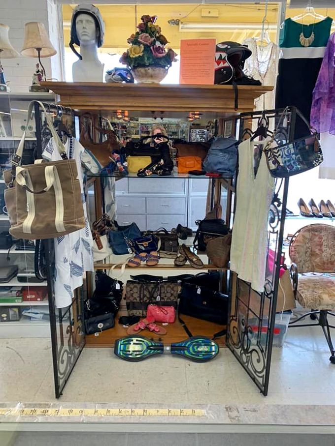 Handbag heaven on an ornate display&mdash;from beach totes to evening clutches, with a surprise hoverboard cameo stealing the spotlight below.