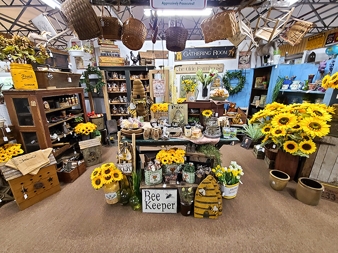 The bee-themed display buzzes with country charm. Sunflowers, honey pots, and rustic signage create a corner of perpetual summer warmth.