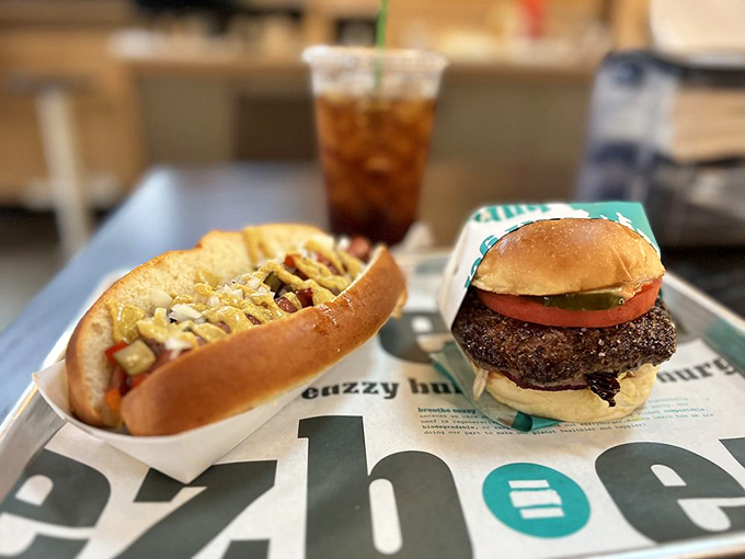 The dynamic duo of comfort food: a classic dog with the works alongside a burger that's dressed to impress.
