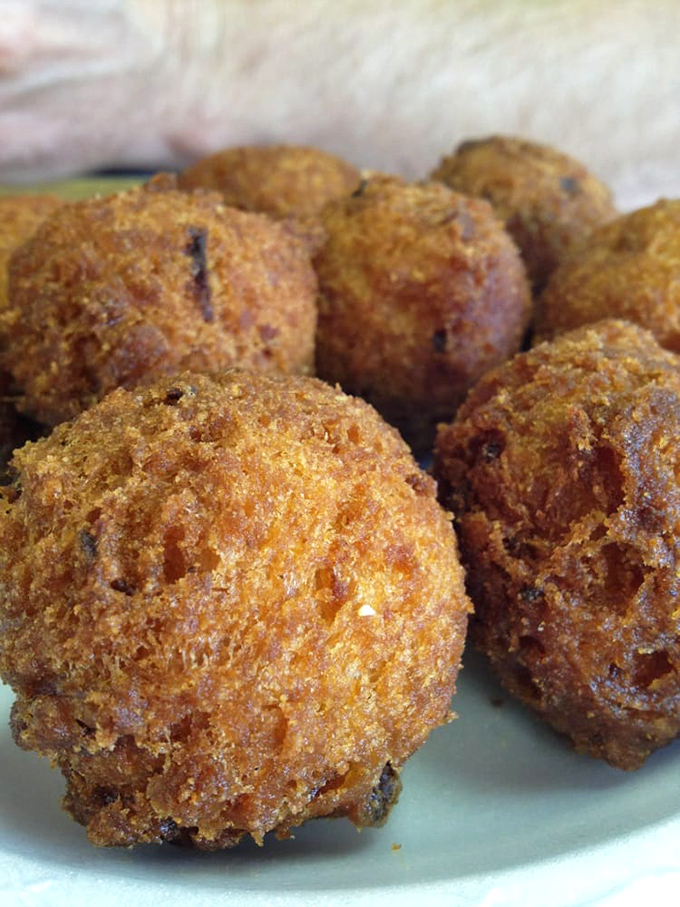 Hush puppies so perfectly golden they deserve their own trophy&mdash;crispy exterior giving way to a tender cornmeal interior that whispers "y'all come back now."