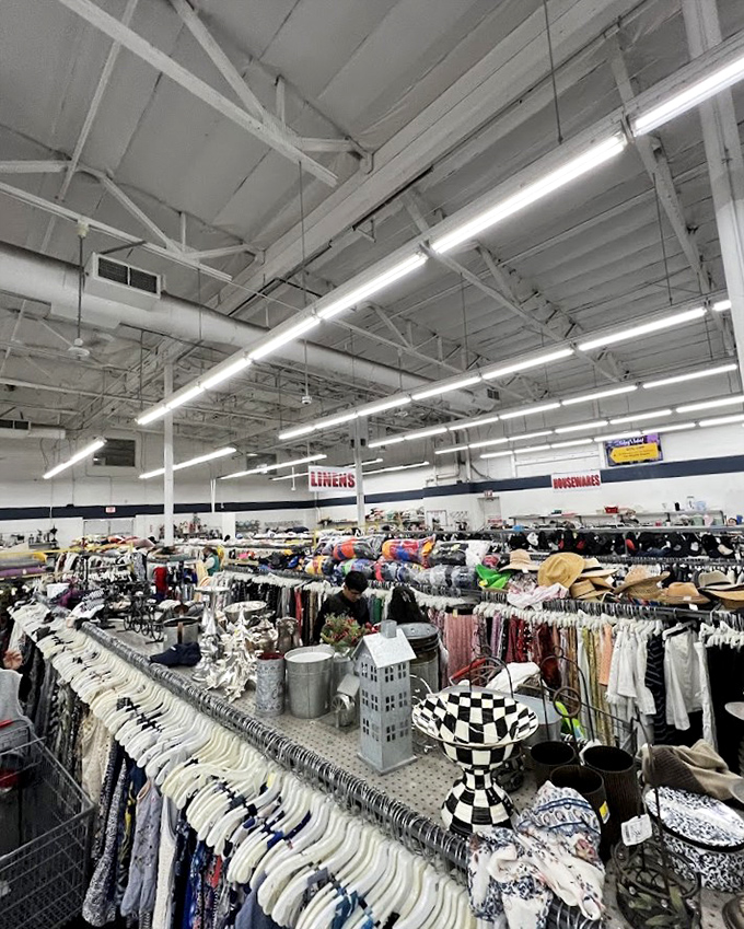 Signs clearly mark departments in this thrifting metropolis, where seasoned shoppers navigate with the precision of urban commuters.