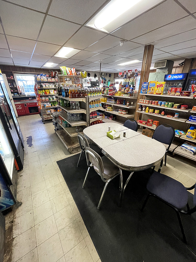 The dining area keeps it real with metal shelving, basic tables, and zero pretension. This is where memories are made between bites of burger perfection.