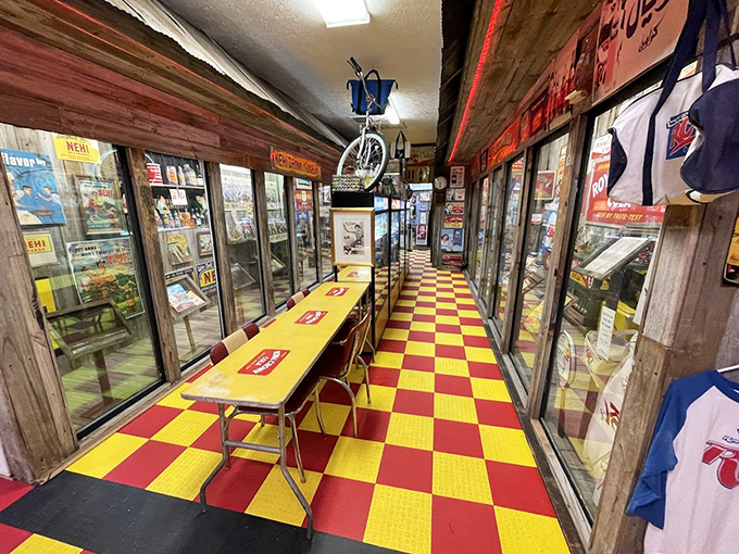 This hallway of nostalgia, with its red and yellow checkerboard floor, feels like walking through the greatest diner that never existed.