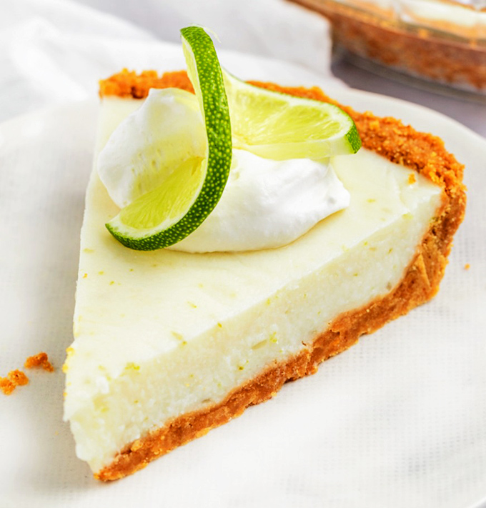 A slice of key lime heaven that proves the best things in life come with a graham cracker crust and a lime garnish.