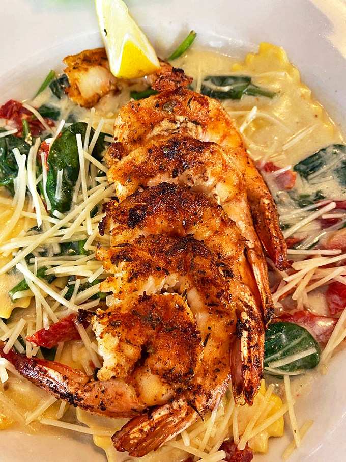 Blackened shrimp that could make a seafood skeptic convert. Perched atop pasta like they own the place.