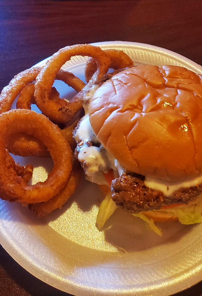 The perfect onion rings don't exi&mdash; Oh wait, there they are, golden halos accompanying a burger that demands your full attention.