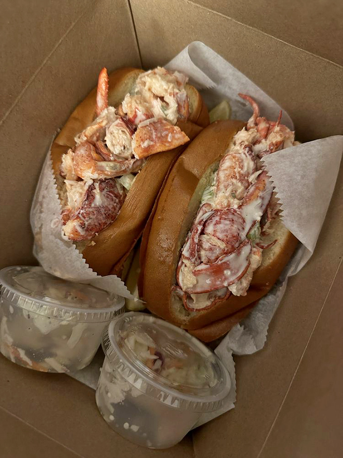 Behold the main event&mdash;lobster rolls so stuffed they're practically blushing, served with tiny cups of butter for those who believe too much is just right.