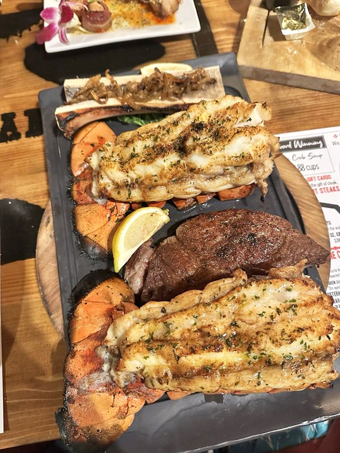 Surf meets turf in this magnificent display&mdash;lobster tails and steak proving that some partnerships are simply meant to be.