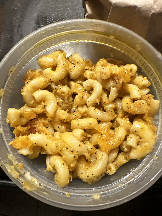 Mac and cheese that achieves that elusive perfect texture &ndash; creamy yet structured, with each pasta curve capturing maximum cheese goodness.