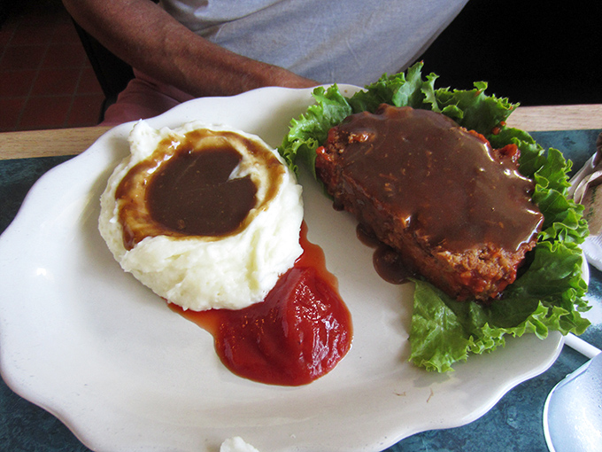 Meatloaf and mashed potatoes—the Fred Astaire and Ginger Rogers of comfort food, dancing perfectly together on a simple white plate.