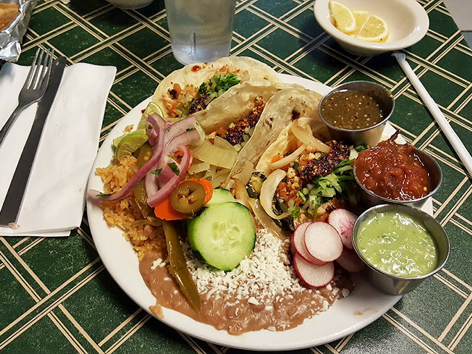 Tacos assembled with the care of a jeweler setting diamonds. Fresh vegetables, multiple salsas, and the promise of a perfect morning.