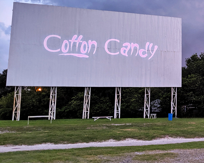 "Cotton Candy" splashed across the massive white screen. Even when empty, the drive-in canvas promises sweetness to come.