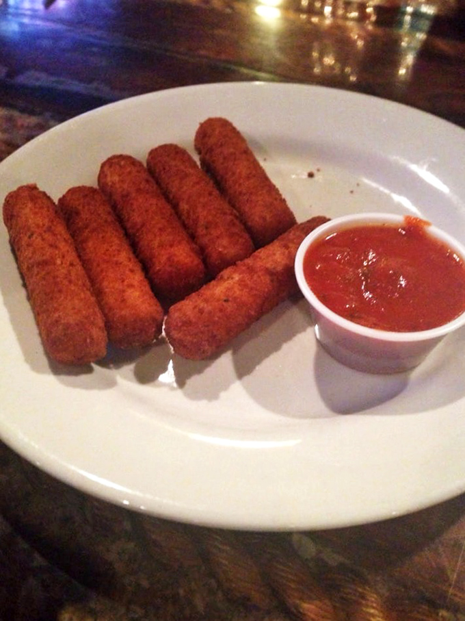 Golden-brown mozzarella sticks lined up like soldiers ready for battle&mdash;the battle against your hunger, that is. Crispy outside, molten inside, happiness all around.