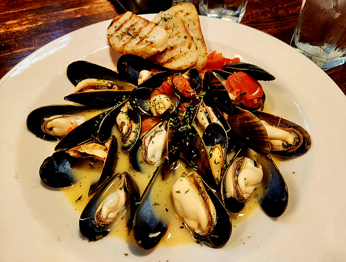 These mussels are having a pool party in white wine broth, and everyone's invited to dive in.