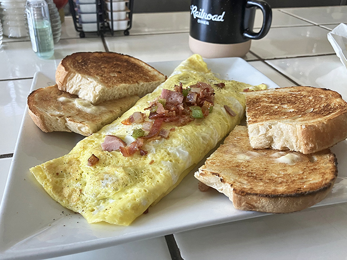 Fluffy omelet perfection showcases why this diner has earned its reputation among breakfast connoisseurs everywhere.