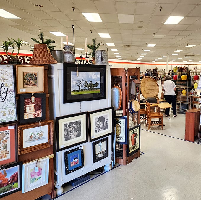 A gallery within a gallery! That lighthouse painting practically begs to brighten a coastal-themed guest bathroom.