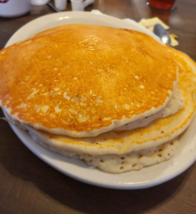 Pancakes so fluffy they could double as pillows &ndash; golden discs of breakfast perfection just waiting for their maple syrup waterfall moment.