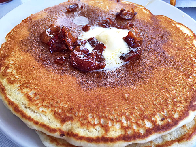 These pancakes have achieved that golden-brown perfection that makes maple syrup and butter perform their happy dance before joining the party.