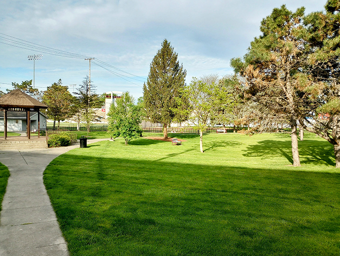 This perfectly manicured park green could double as a movie set where the protagonist realizes they prefer small-town charm to big-city chaos.