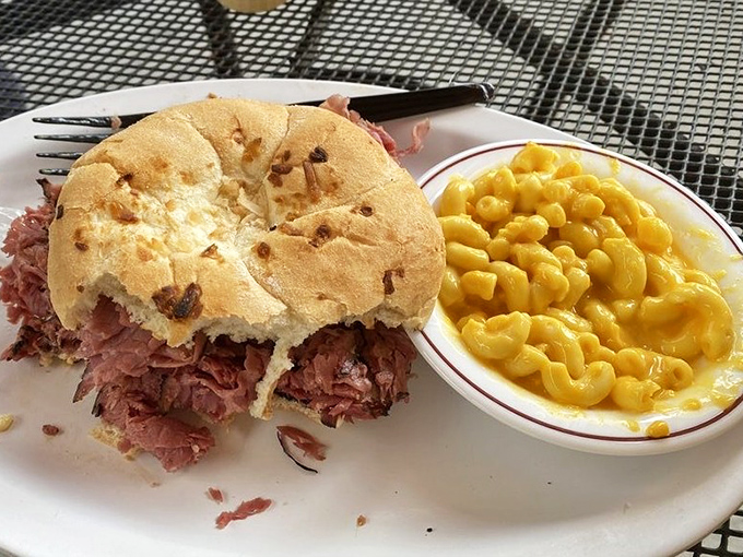 A pastrami sandwich so generous it requires a strategy to eat. The mac and cheese alongside isn't just comfort food&mdash;it's emotional support in a bowl. 