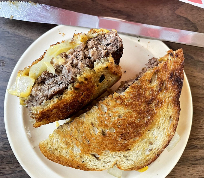 The patty melt: where beef, bread, and cheese perform a perfectly choreographed dance that ends with you needing a nap.