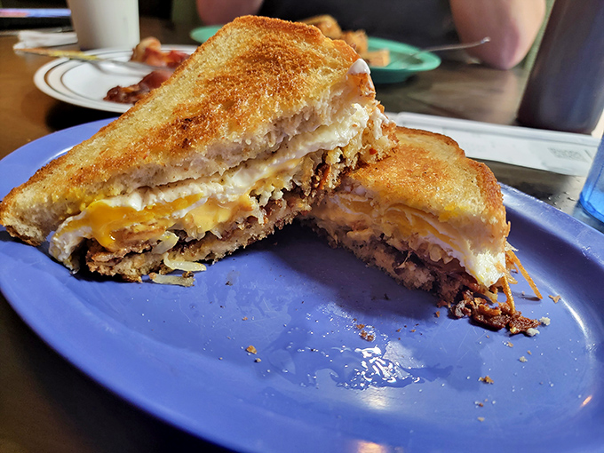 This isn't just a sandwich—it's an architectural masterpiece of melted cheese, grilled bread, and savory filling that demands respect.
