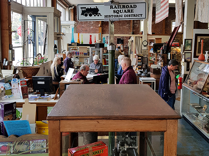 The Railroad Square Historic District sign watches over shoppers hunting for that perfect find. The thrill of the chase is half the fun.