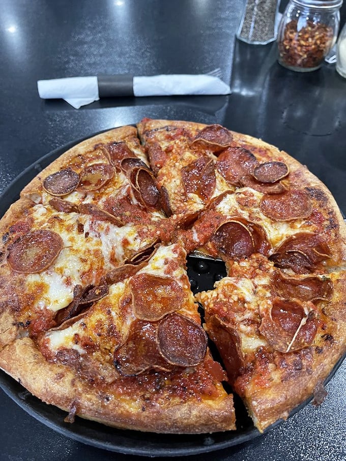 The star of the show: that pepperoni pizza with its perfectly curled cups creating little pools of spicy oil. This is what pizza dreams are made of.