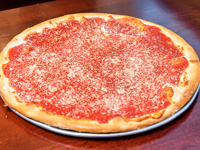 The tomato pie speaks the universal language of simplicity&mdash;a thin crust canvas painted with vibrant sauce and a dusting of cheese that whispers rather than shouts.