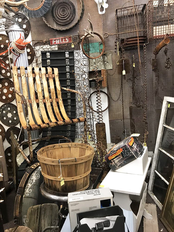 The "I might need this someday" corner, where rusty treasures await their Pinterest resurrection. That wooden bushel basket has stories to tell!