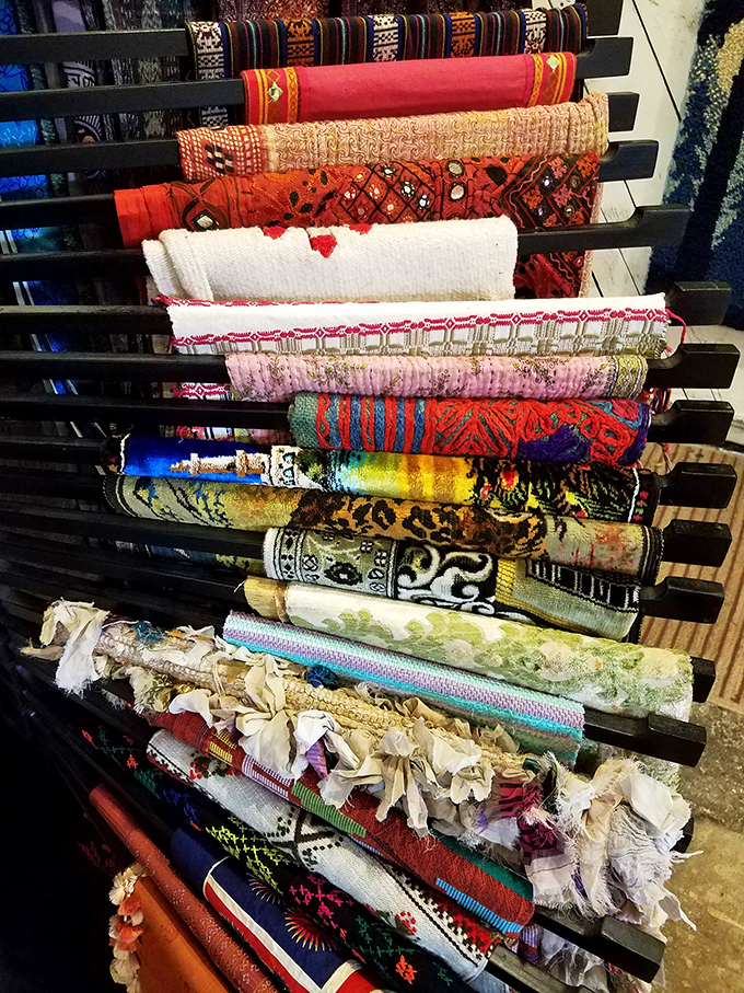 A rainbow of textiles stacked like the world's most inviting layer cake. Go ahead, pull one out &ndash; nobody's judging.