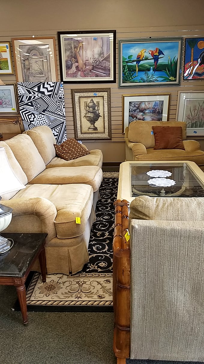 The art wall creates an impromptu gallery where tropical birds, abstract designs, and classic prints compete for your attention and wall space.