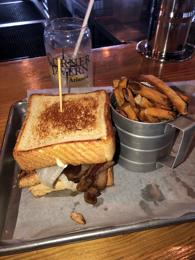 A sandwich that demands to be photographed before eating, though your patience will be tested as the aroma wafts upward, promising satisfaction between two perfectly toasted slices.