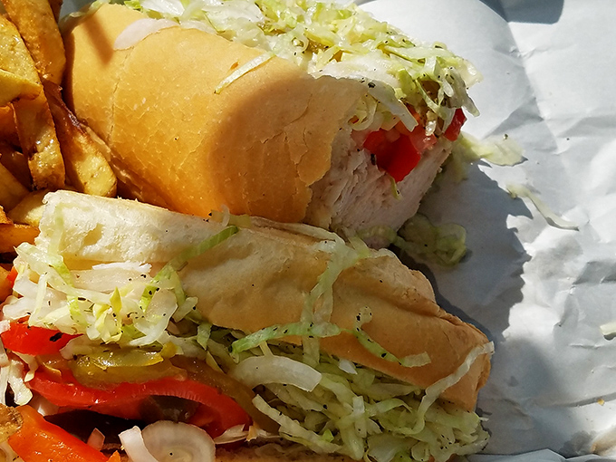 Fresh toppings add crunch and color to hearty meat, creating that perfect bite that haunts your dreams afterward.