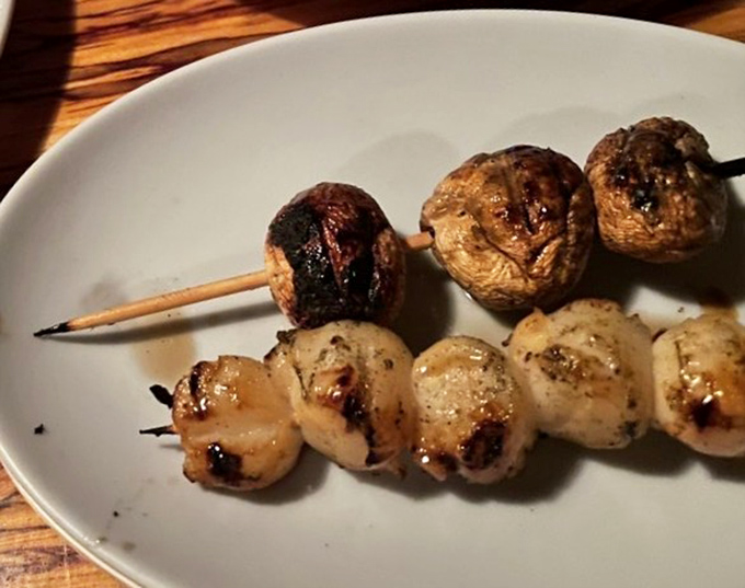 The legendary scallops and mushrooms on a stick. This simple skewer showcases the kitchen's philosophy: respect your ingredients, add fire, and let magic happen.