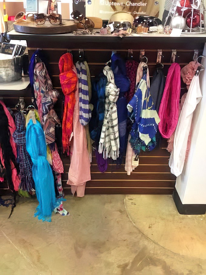 A rainbow of scarves waiting to transform basic outfits into "I have a personal stylist" territory &ndash; affordable neck real estate.