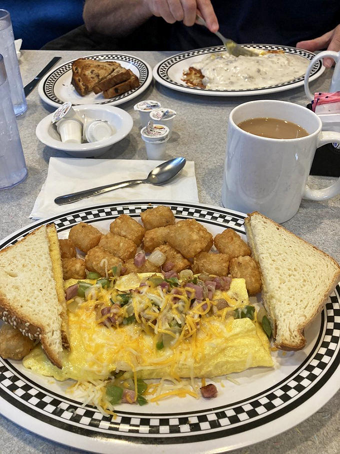 An omelet that's seen things&mdash;namely ham, cheese, and vegetables&mdash;all tucked under a comforting blanket of melted goodness.