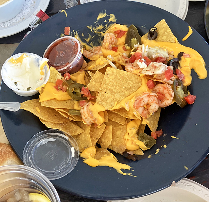 Seafood nachos that transform humble tortilla chips into a coastal celebration worthy of any happy hour gathering.
