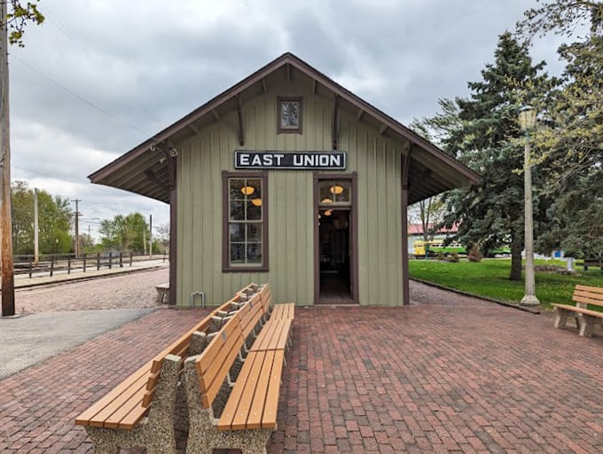 The charming East Union station building, with its wooden benches and brick plaza, offers a perfect spot to rest between explorations of railroad history.