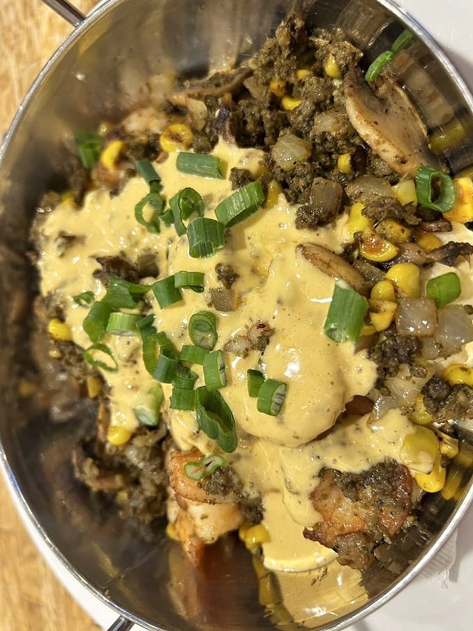 A skillet of savory goodness topped with green onions that adds just the right amount of bite. Comfort food that hugs you from the inside.