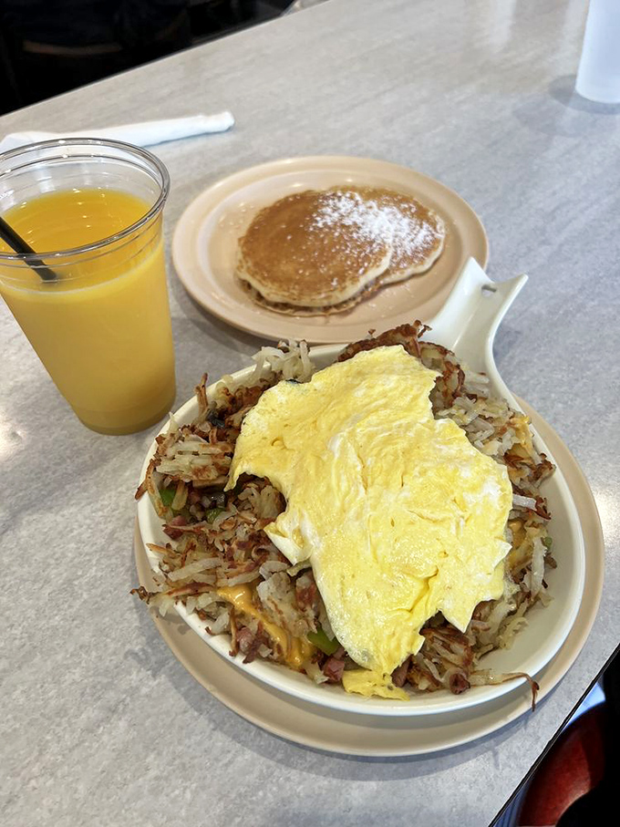 This skillet doesn't just feed you; it tells a story of crispy potatoes, melted cheese, and eggs that gave their all for your satisfaction.