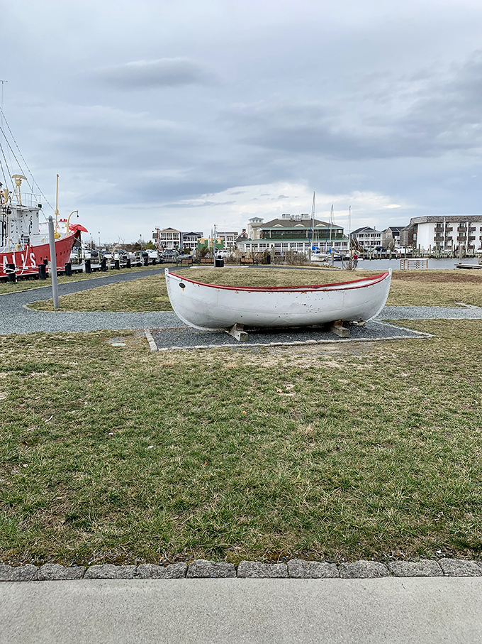 Not every vessel gets to retire with such dignity—this small boat display complements its much larger cousin in nautical storytelling.