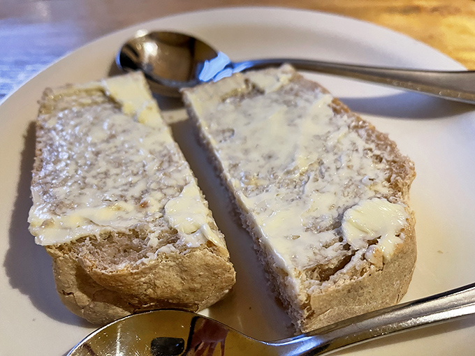 Fresh sourdough bread so inviting, it practically begs you to abandon all dietary resolutions without a moment's hesitation.