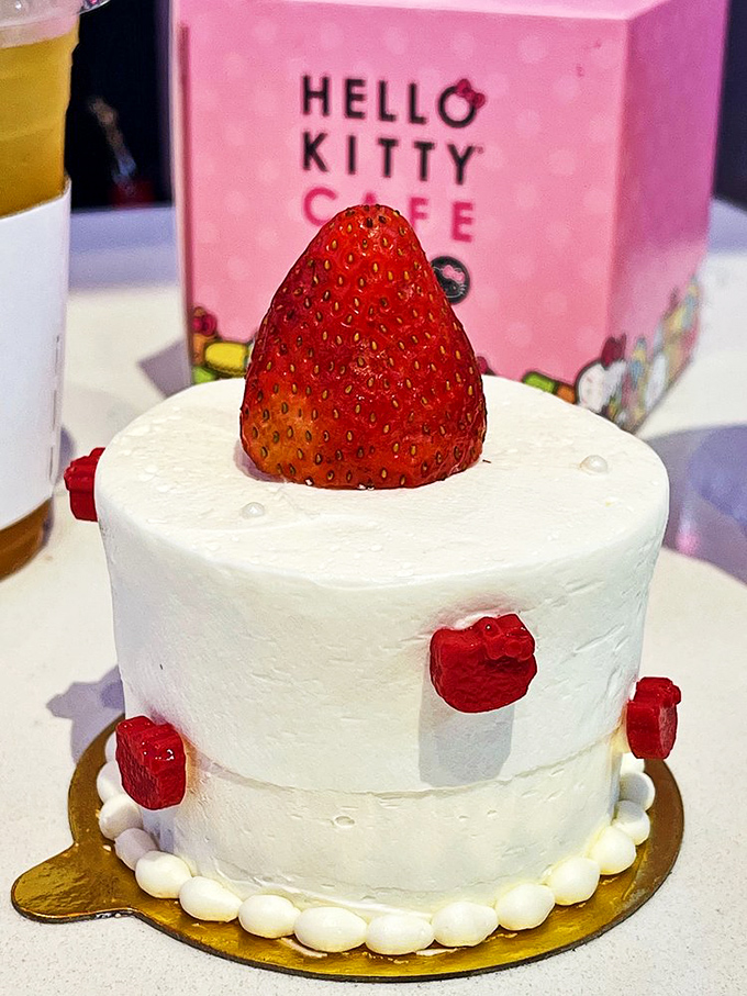 This strawberry-topped cake isn't just dessert – it's a minimalist masterpiece where every raspberry accent plays a crucial supporting role.