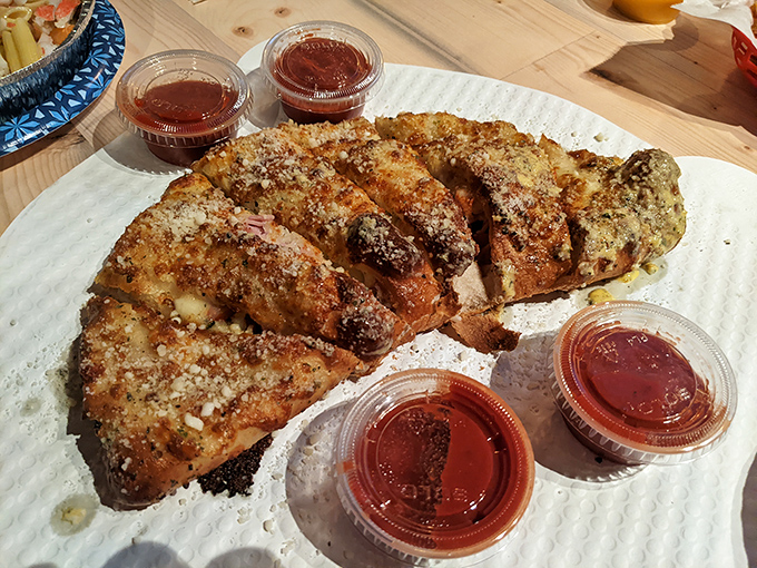 The garlic parmesan breadsticks deserve their own fan club. Crispy edges, soft centers, and enough cheese to make Wisconsin nervous.