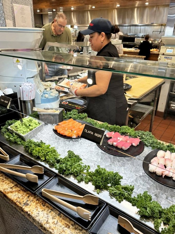 At the sushi station, fresh nigiri awaits while a skilled chef prepares the next batch &ndash; a delicious assembly line of oceanic delights.