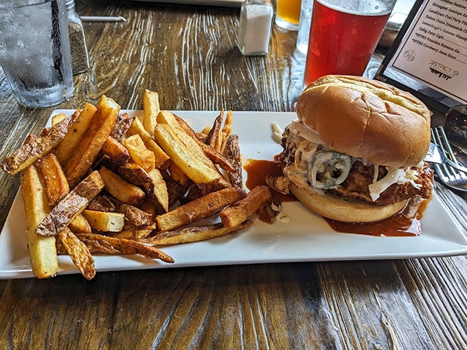 A burger that doesn't need a passport to travel between comfort food and gourmet &ndash; topped with what appears to be caramelized onions and melty cheese.
