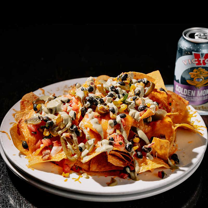 Nachos that laugh in the face of moderation, where every chip is a treasure hunt for the perfect combination of toppings.